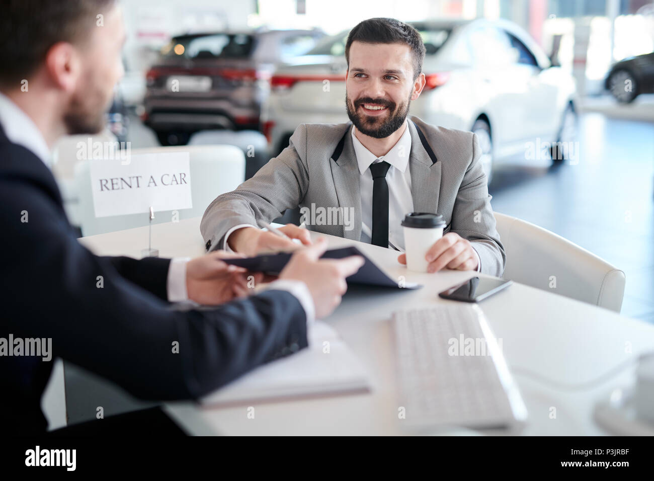 Happy Businessman Renting Car Stock Photo - Alamy
