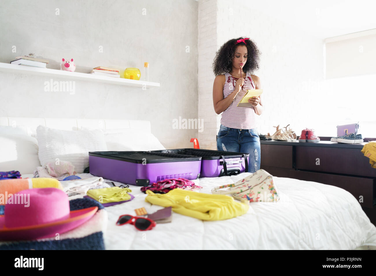 Female travel packing checklist hi-res stock photography and images - Alamy