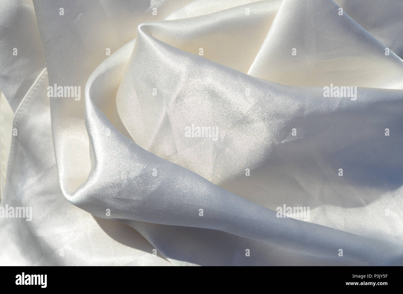 Smooth elegant white silk or satin luxury cloth texture can use as ...