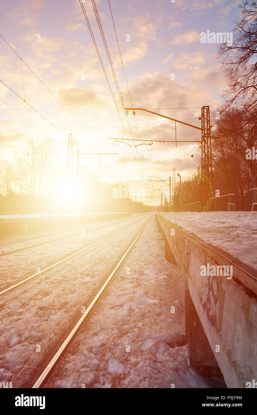 Evening winter landscape with the railway station. Snow-covered railway ...