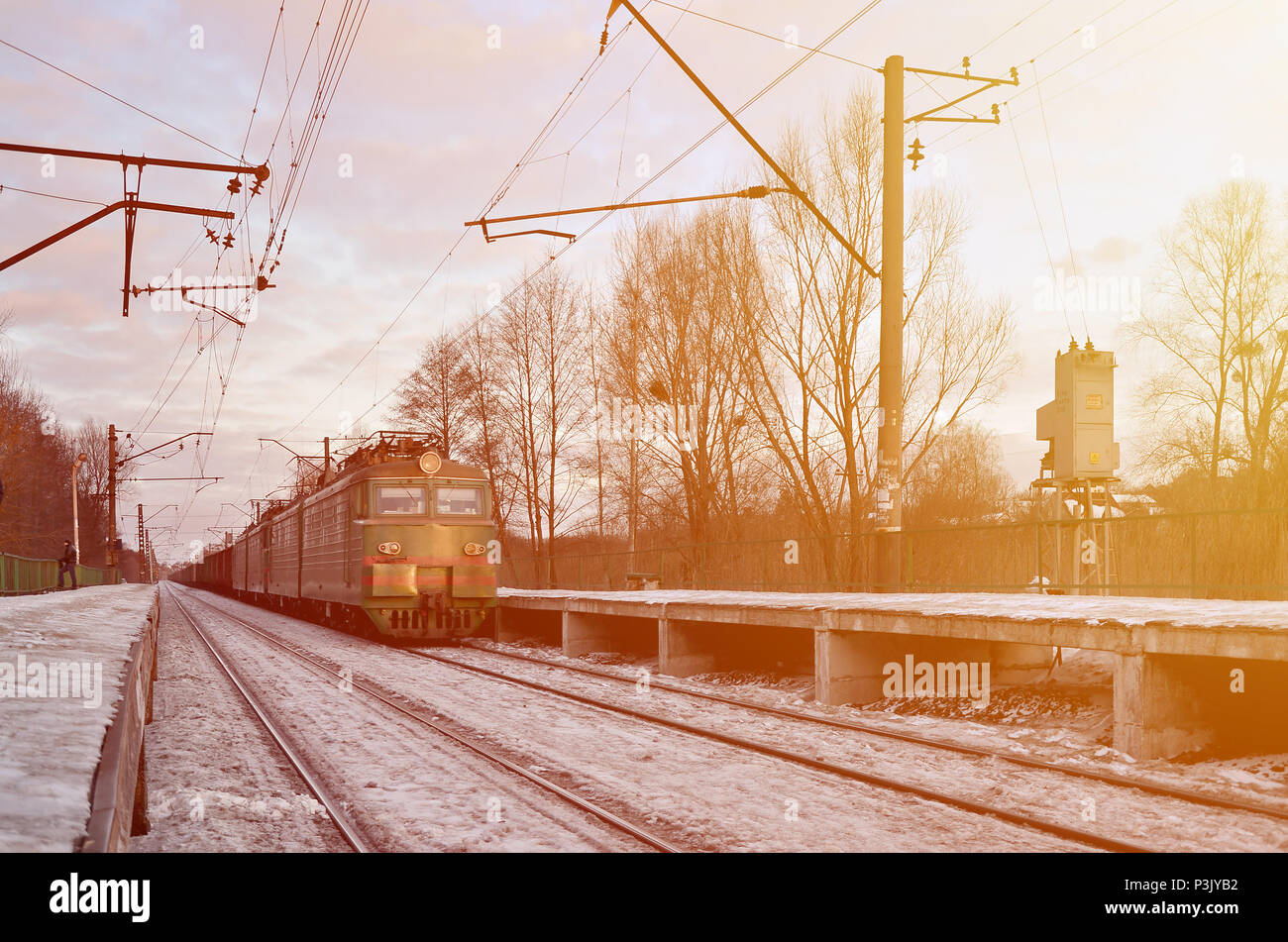 Photo of bright and beautiful sunset on a cloudy sky in cold winter ...