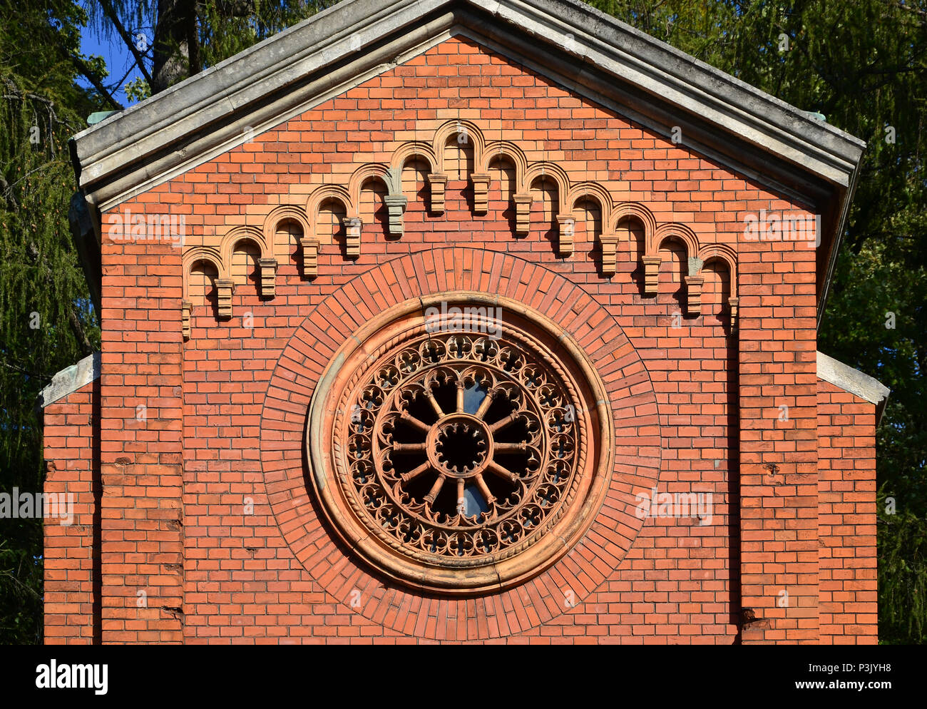 Texture front part of an ancient brick crypt with a round patterned ...