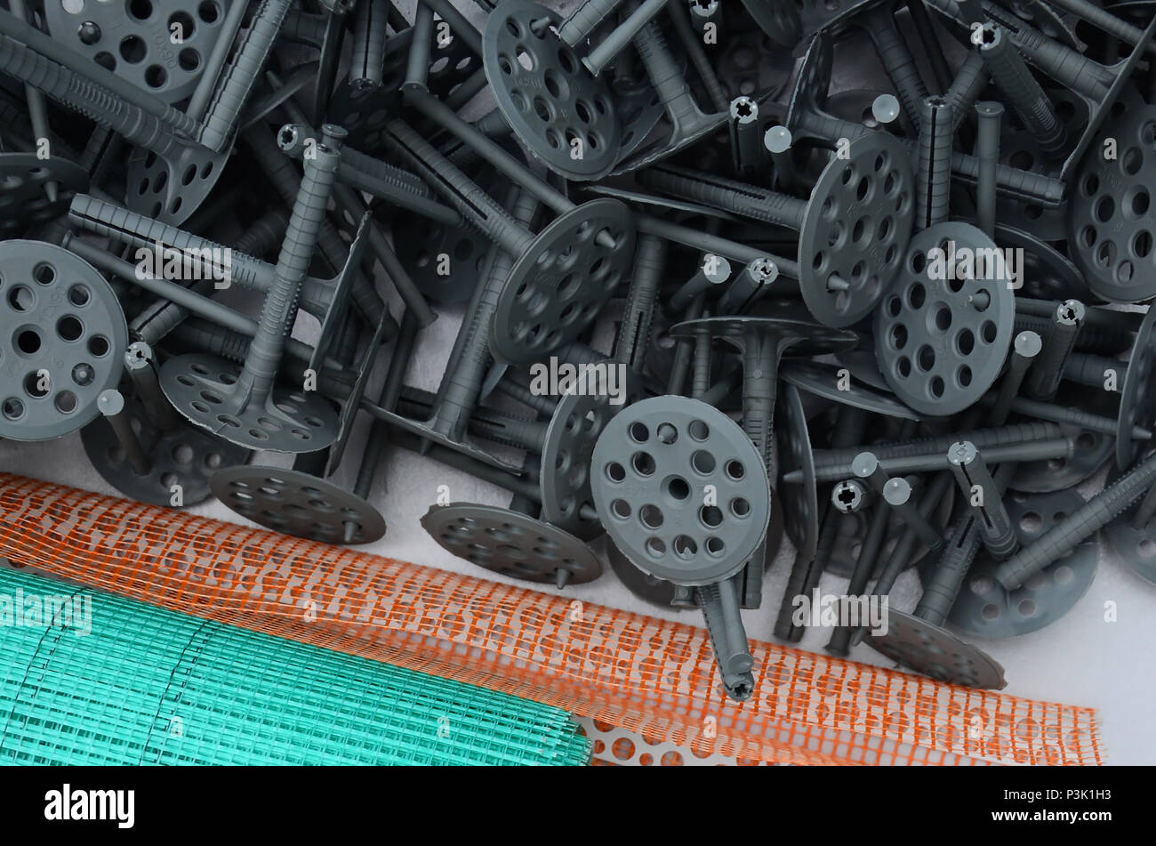 A set of construction items for the insulation of walls. Plastic dowels ...