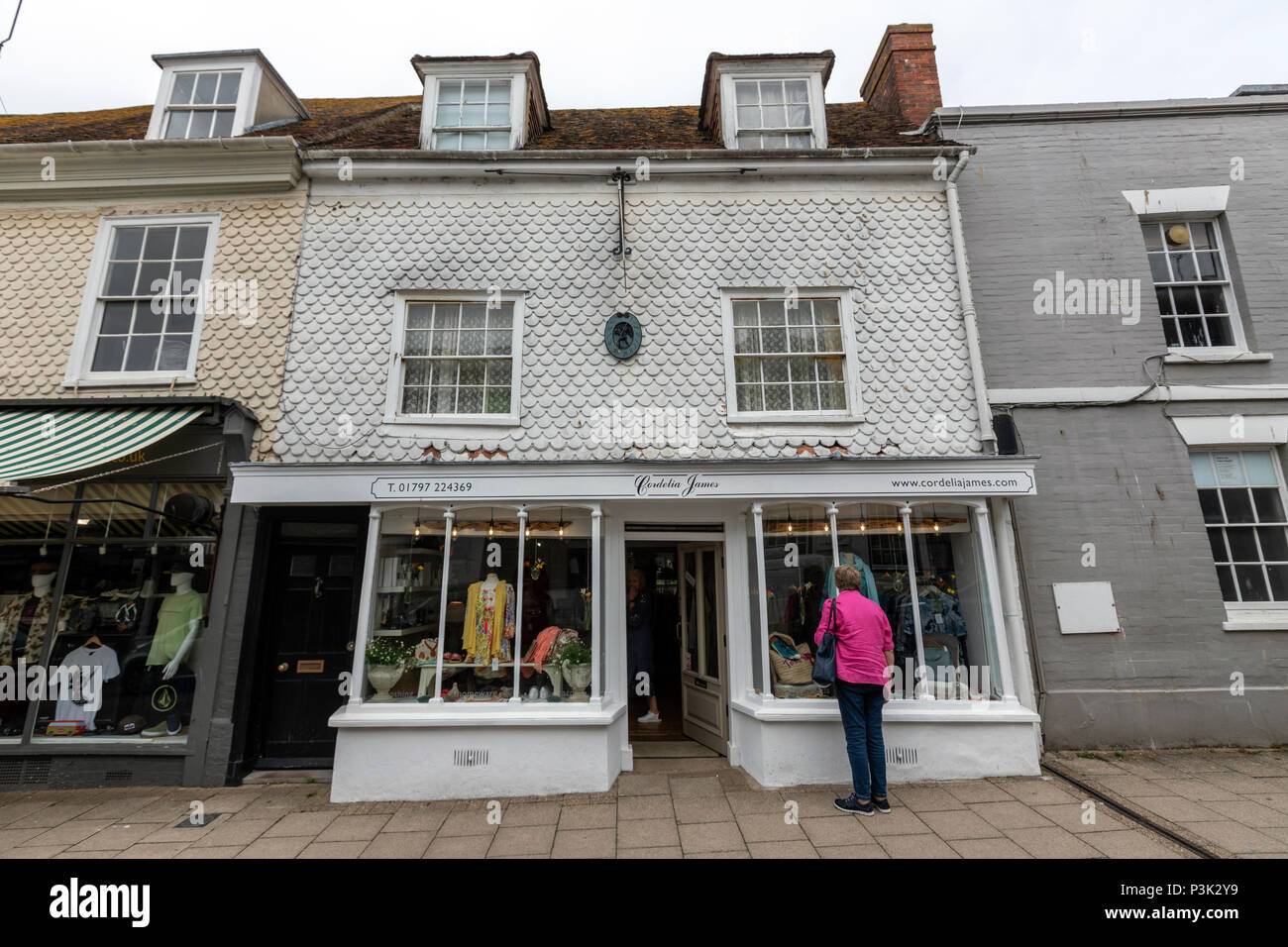 Woman looking the Cordelia James fashion Boutique in High St in Rye ...