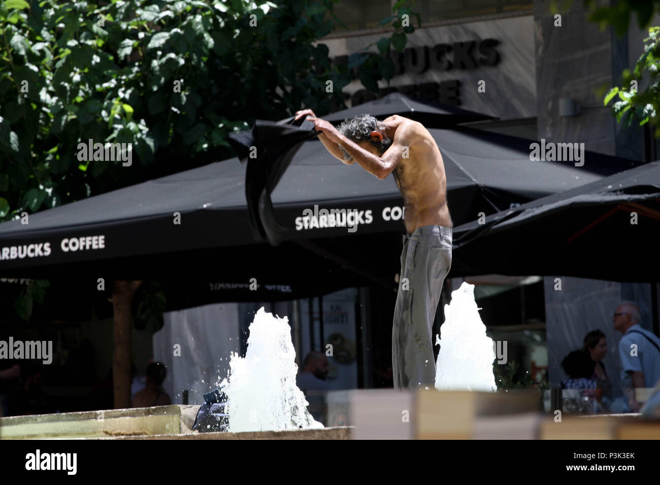 Homeless man in public fountain hi-res stock photography and images - Alamy