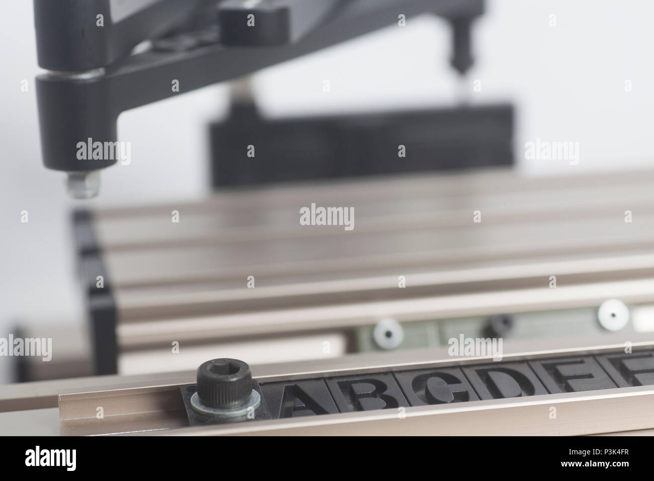 Engraving device pantograph with letterpress alphabet closeup Stock ...