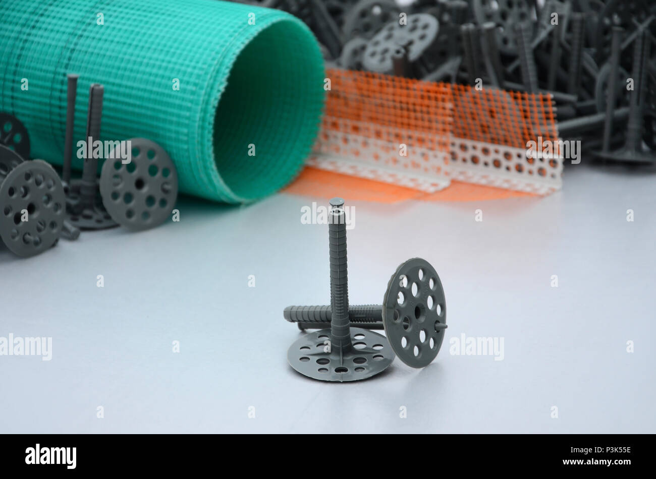 A set of construction items for the insulation of walls. Plastic dowels ...