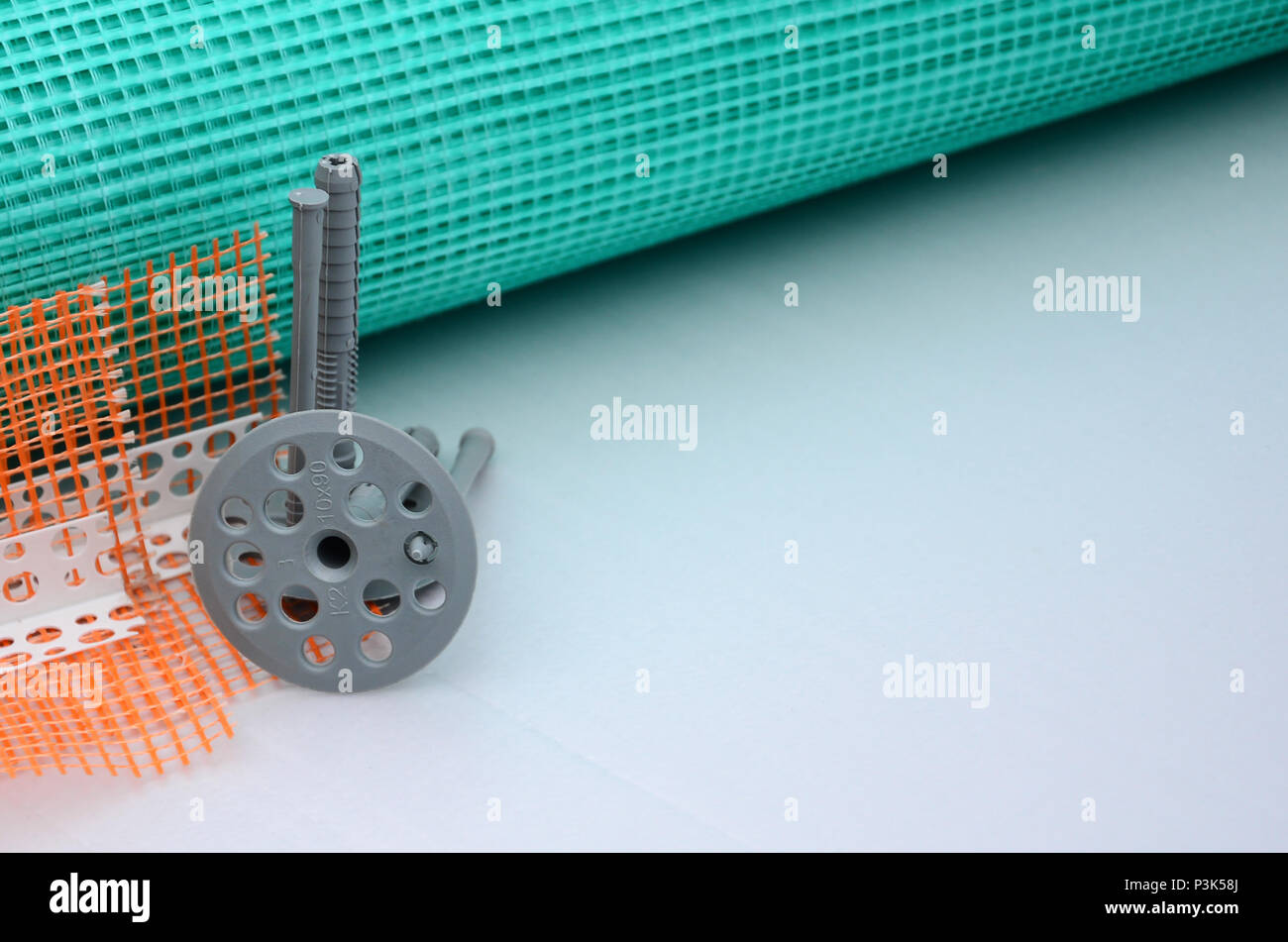 A set of construction items for the insulation of walls. Plastic dowels ...