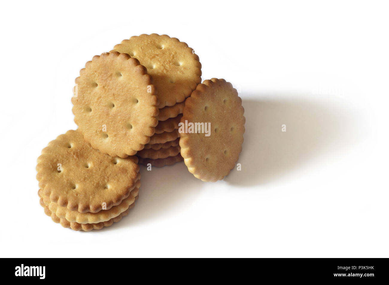Classic round golden yellow salted cracker isolated on over white ...