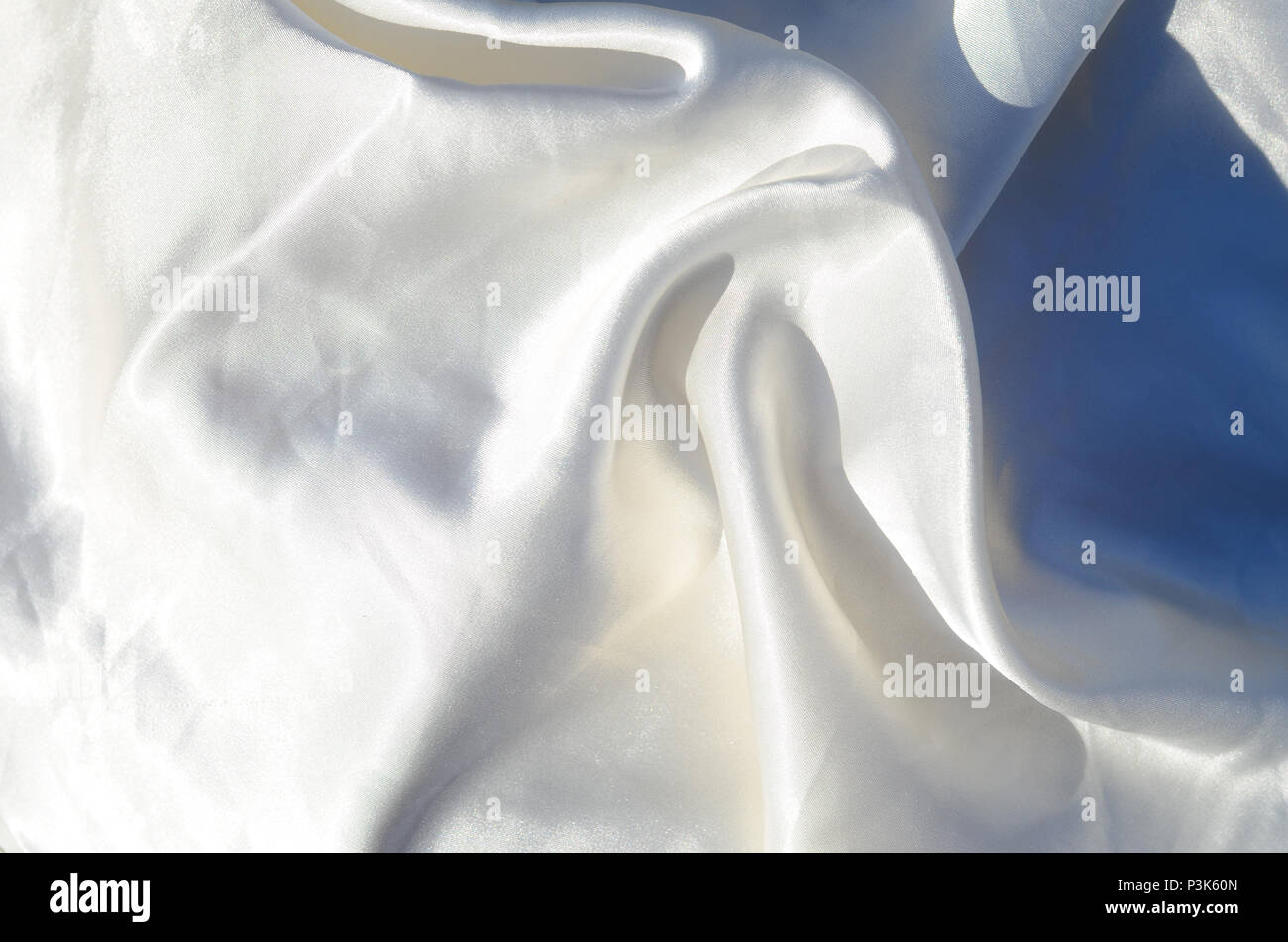 Smooth elegant white silk or satin luxury cloth texture can use as ...