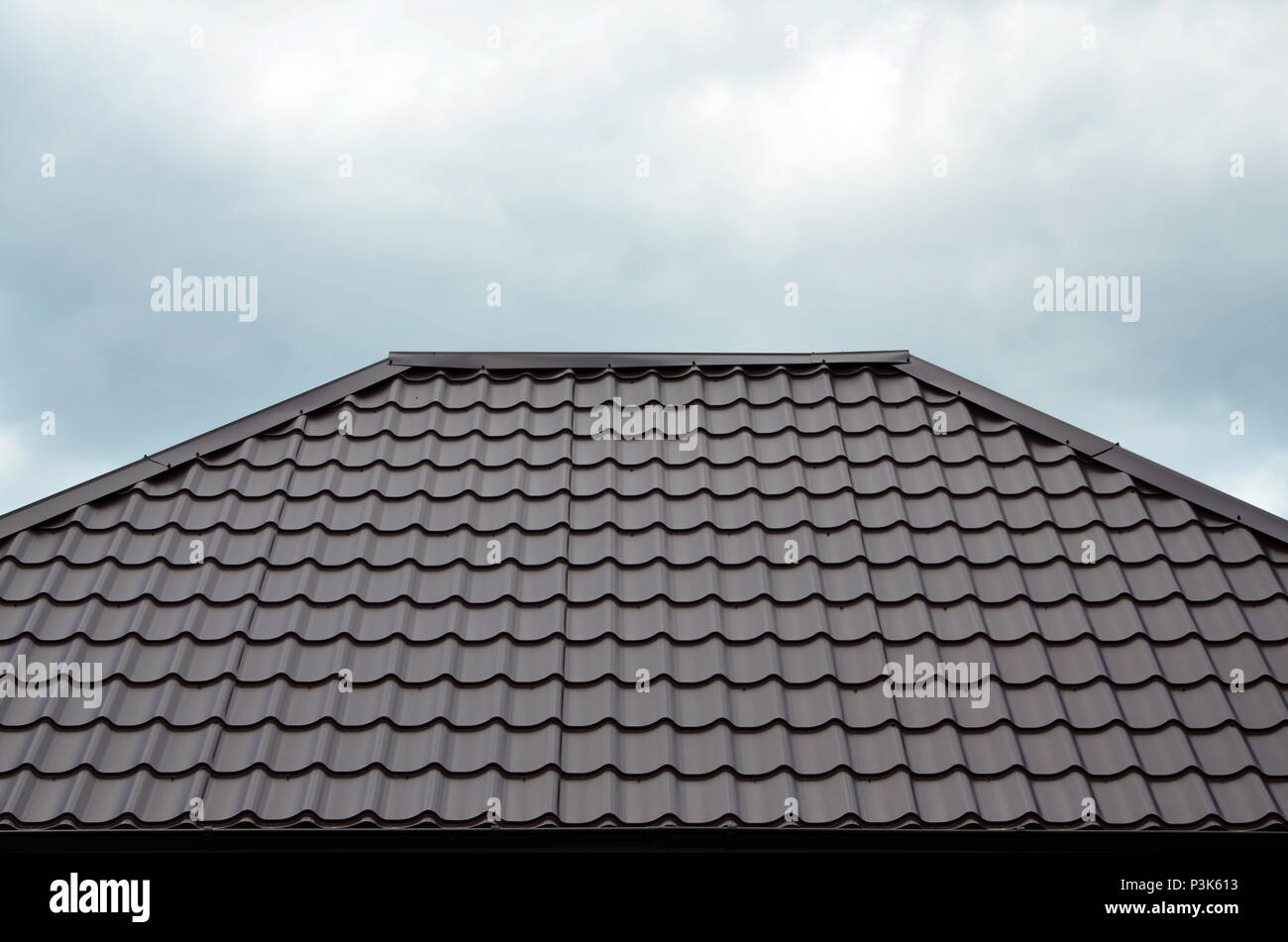 Brown roof tiles or shingles on house as background image. New ...