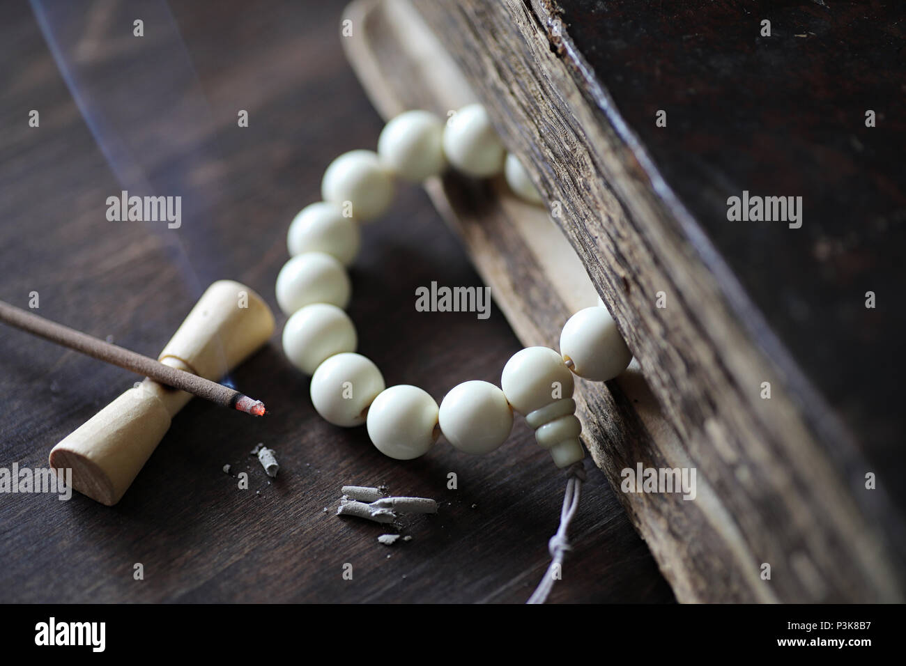 Different objects with traditional religious oriental on a wooden ...