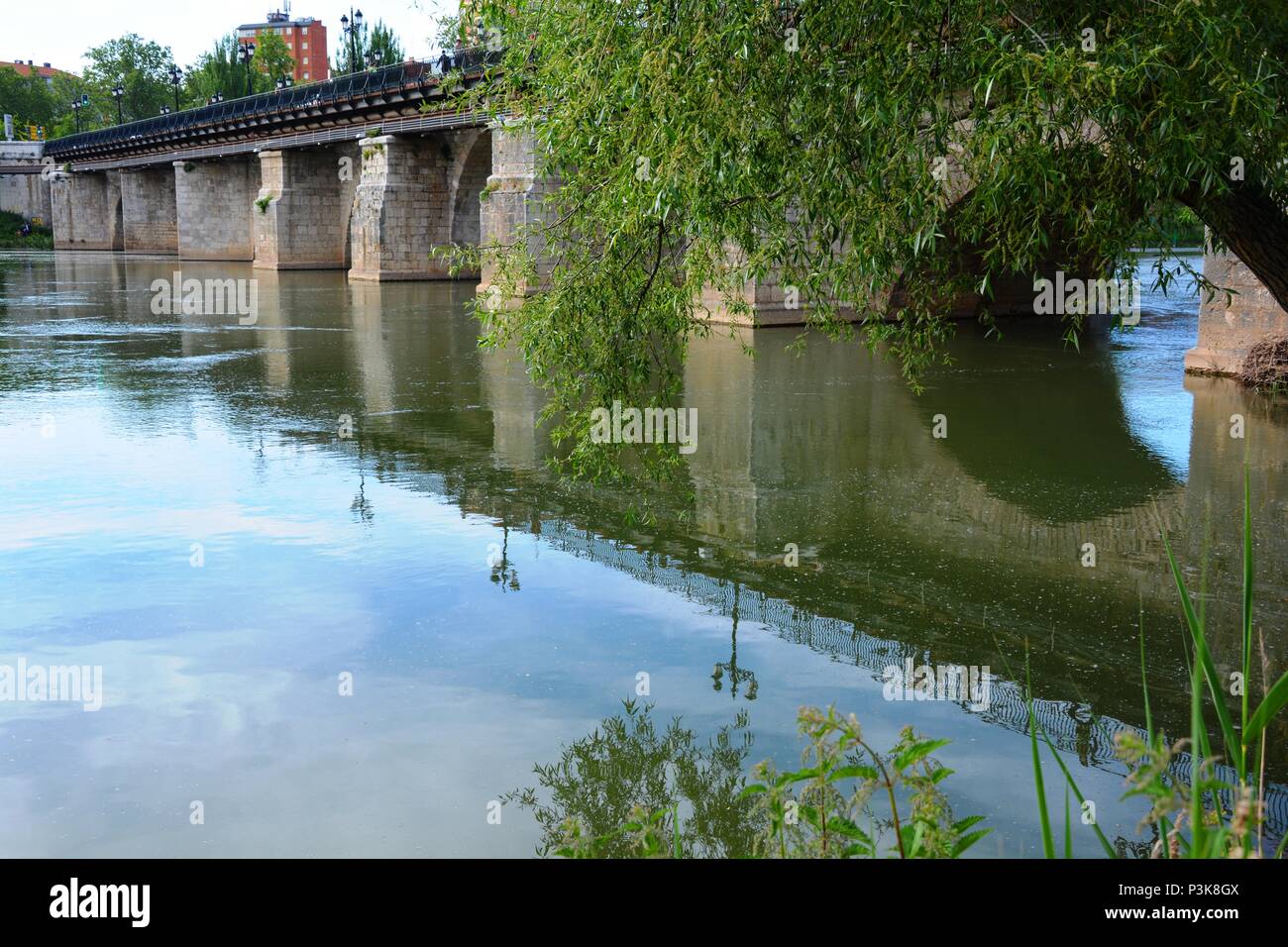 An old bridge reflected on the river Stock Photo - Alamy