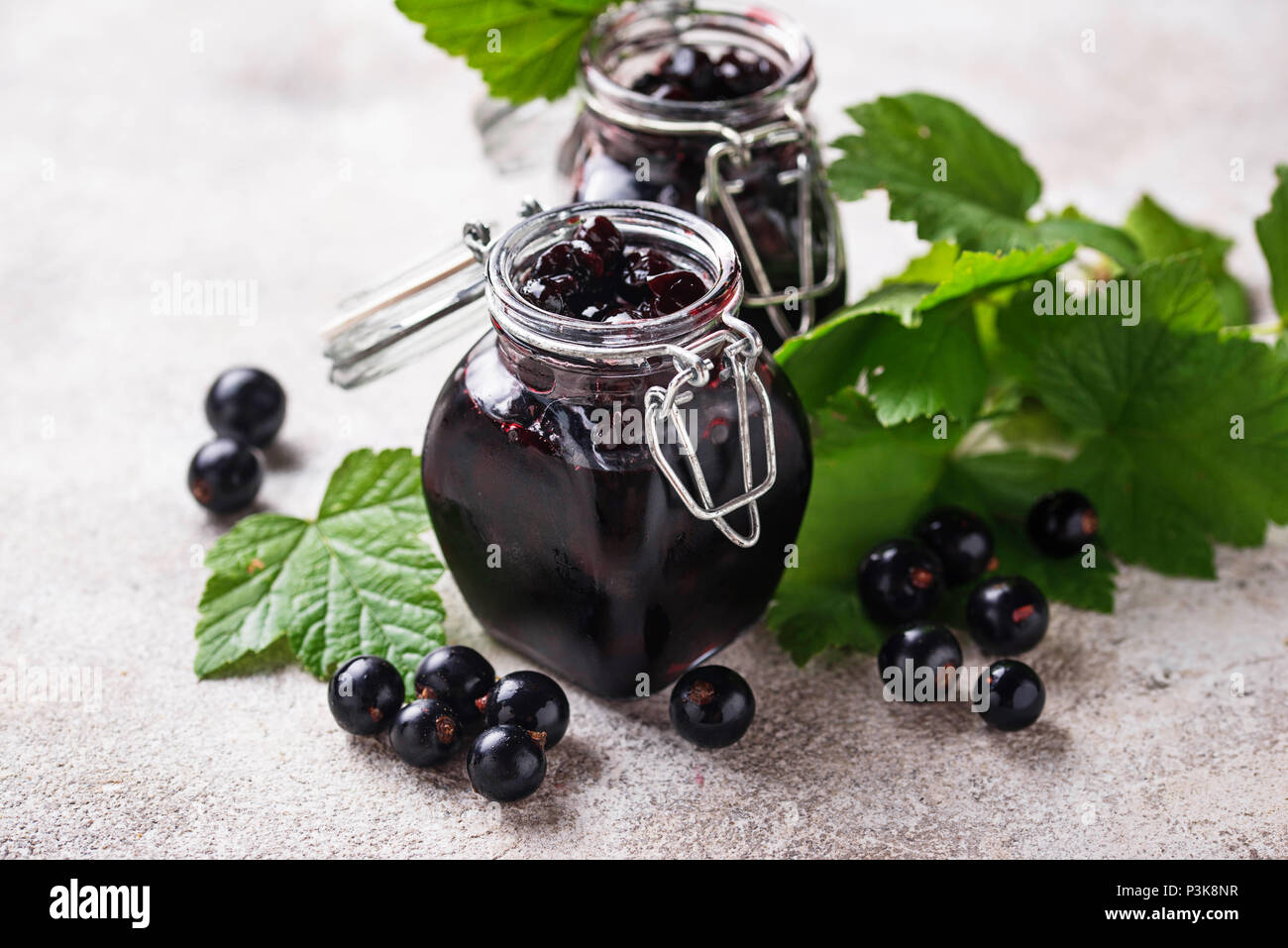 Black currant jam in jar Stock Photo - Alamy