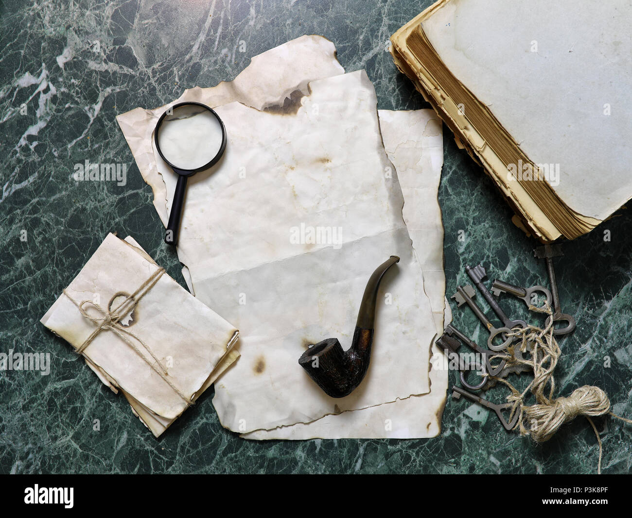 retro papers and book on detective work table with tools background ...