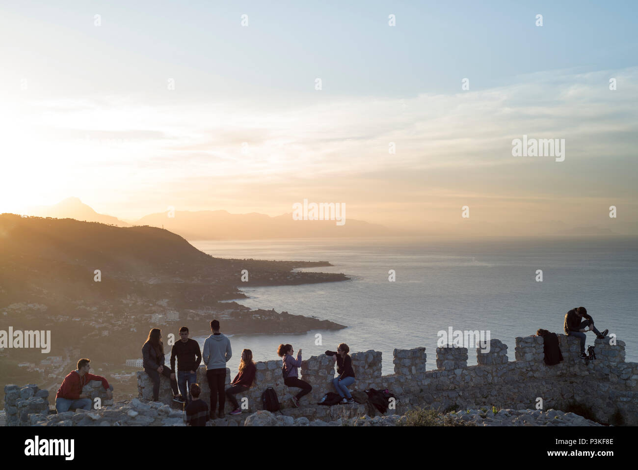 People watching sunset from Cefalu Castle, Rocca di Cefalu, Sicily ...