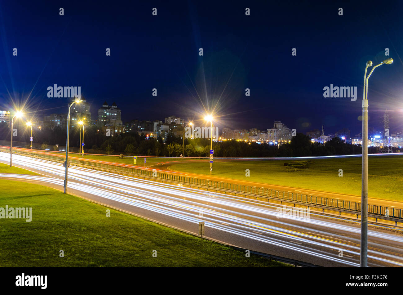 Night Traffic with Light Trails on Highway Interchange. Night City ...