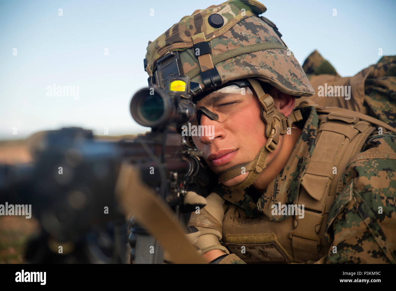 Lance Cpl. Jeremy A. Suarez, a rifleman, sets security for a simulated ...