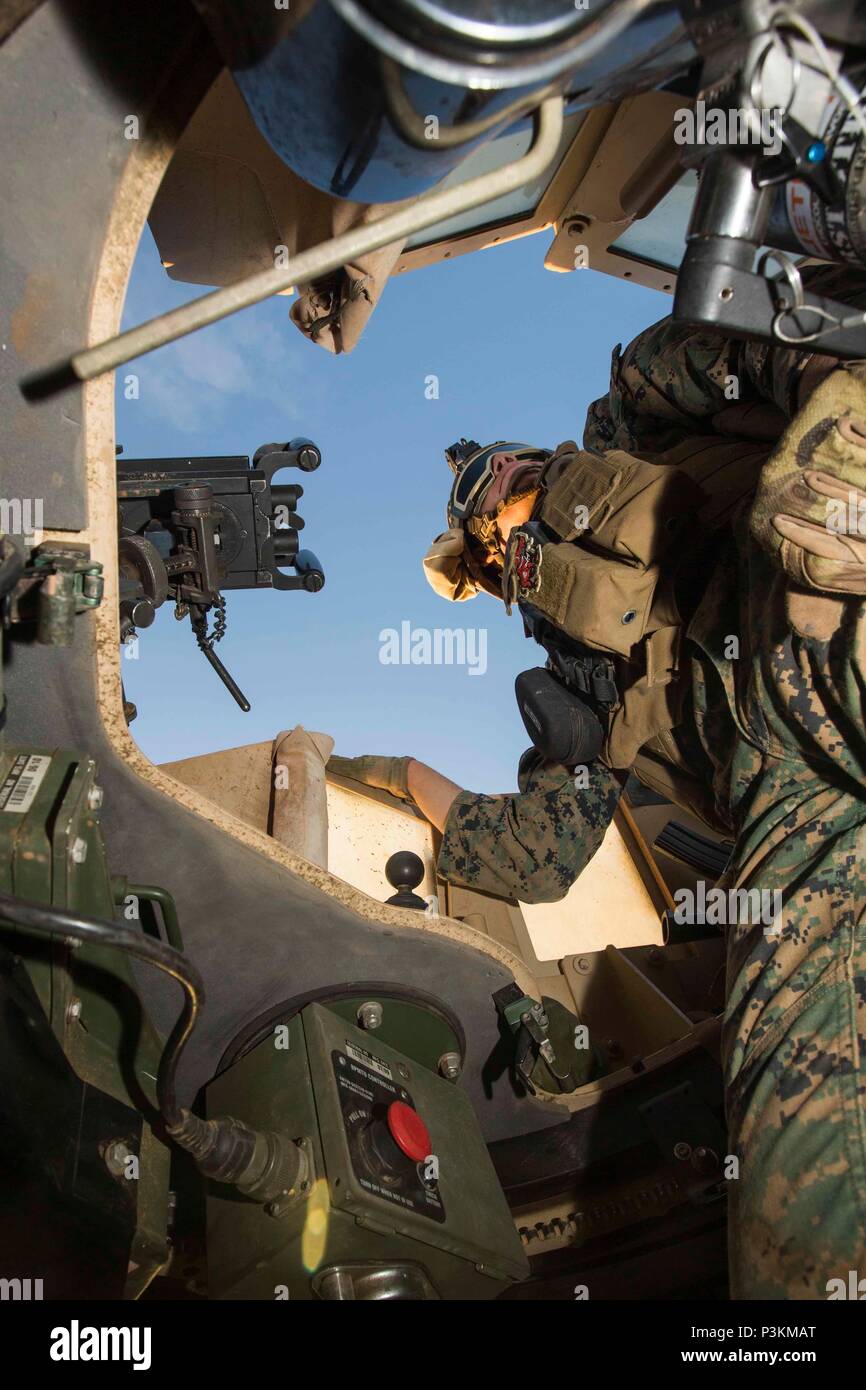 Lance Cpl. Nick J. Padia, a gunner, mans the turret of a humvee at ...