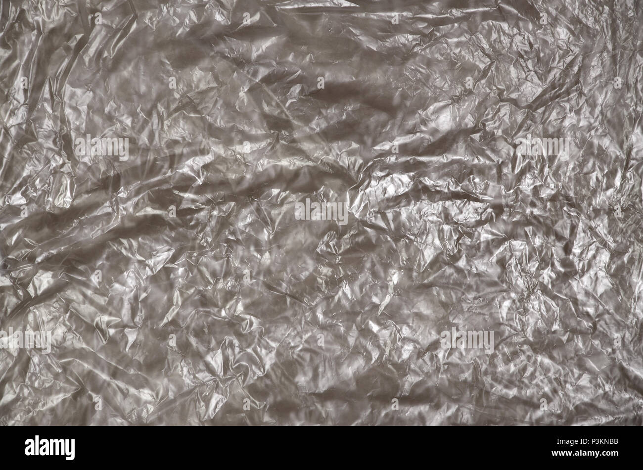 Texture of white crumpled cellophane surface transparent on sunlight ...