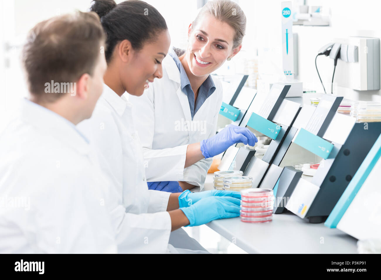 Group of researchers using scientific technology for test of samples ...