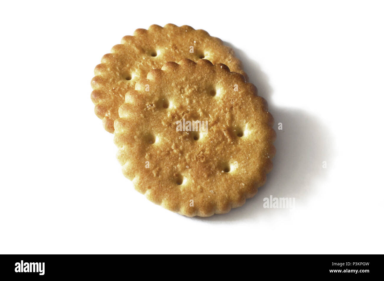 Classic round golden yellow salted cracker isolated on over white ...
