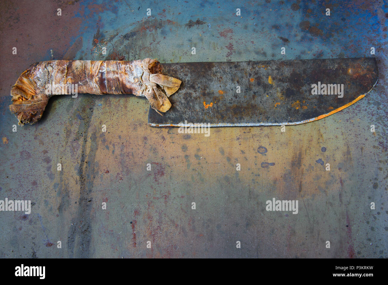 Vintage butcher cleaver on grunge rusty table, space for text or menu ...