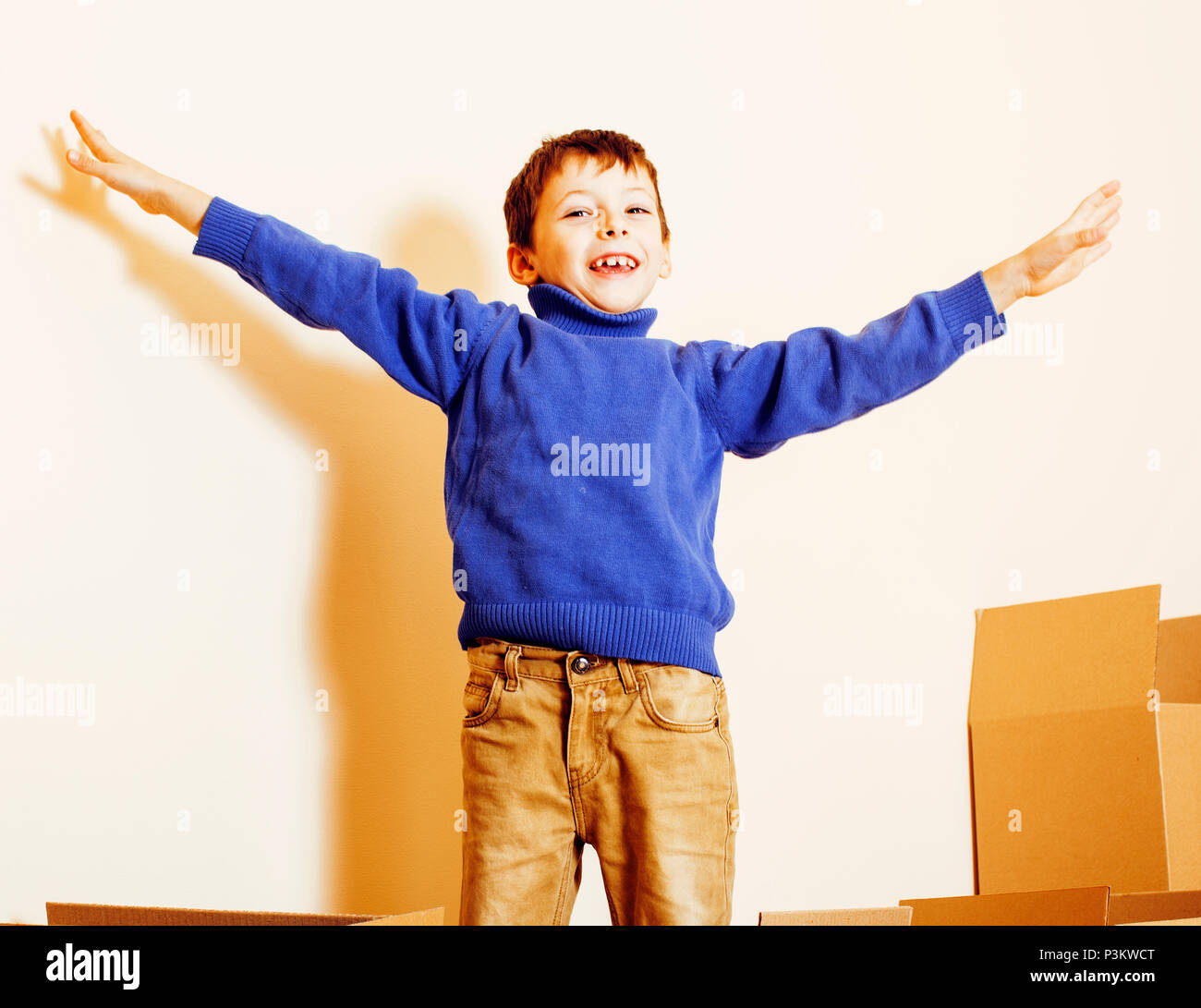 little cute boy in empty room, remoove to new house. home alone Stock ...
