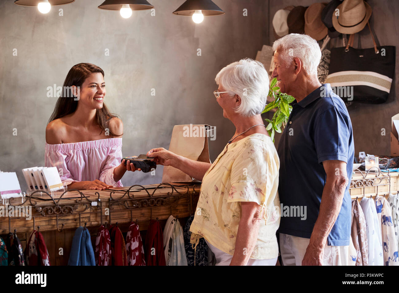 Senior Customers Buying Goods In Store Using Contactless Payment Stock ...