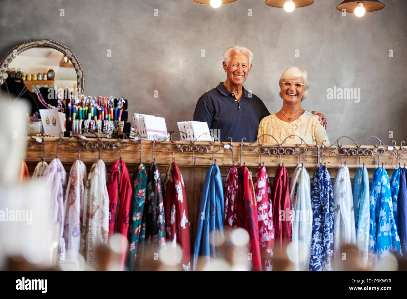 Portrait Of Senior Store Owners Standing Behind Cash Desk Stock Photo ...
