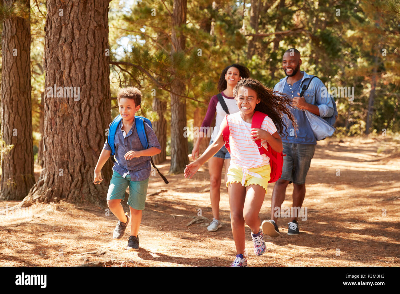 Children running hi-res stock photography and images - Alamy