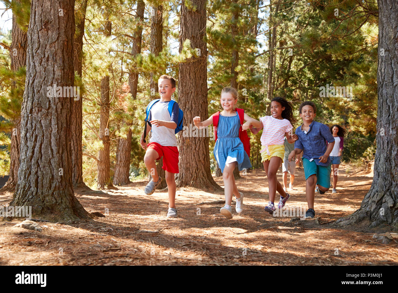 Children running hi-res stock photography and images - Alamy