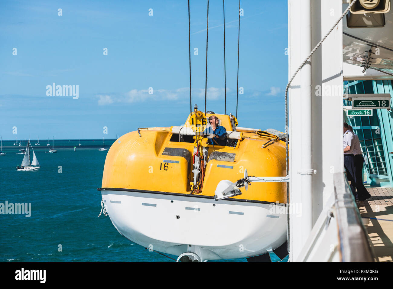 Yellow and White Lifeboat on Pulley on Side of Cruise Ship Stock Photo ...