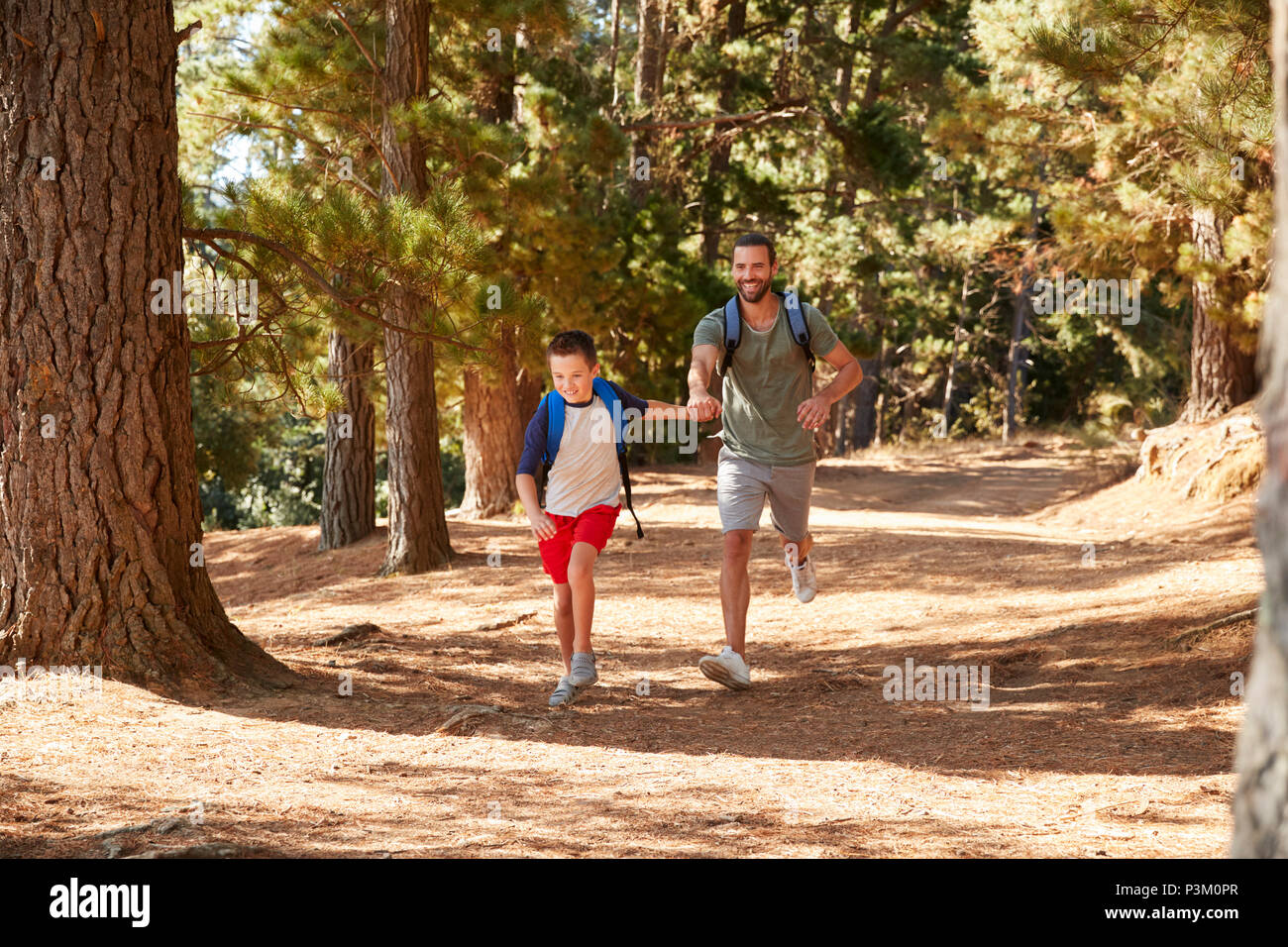 Father son holding hands running hi-res stock photography and images ...