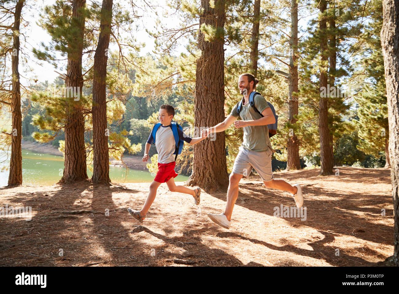 Father son holding hands running hi-res stock photography and images ...