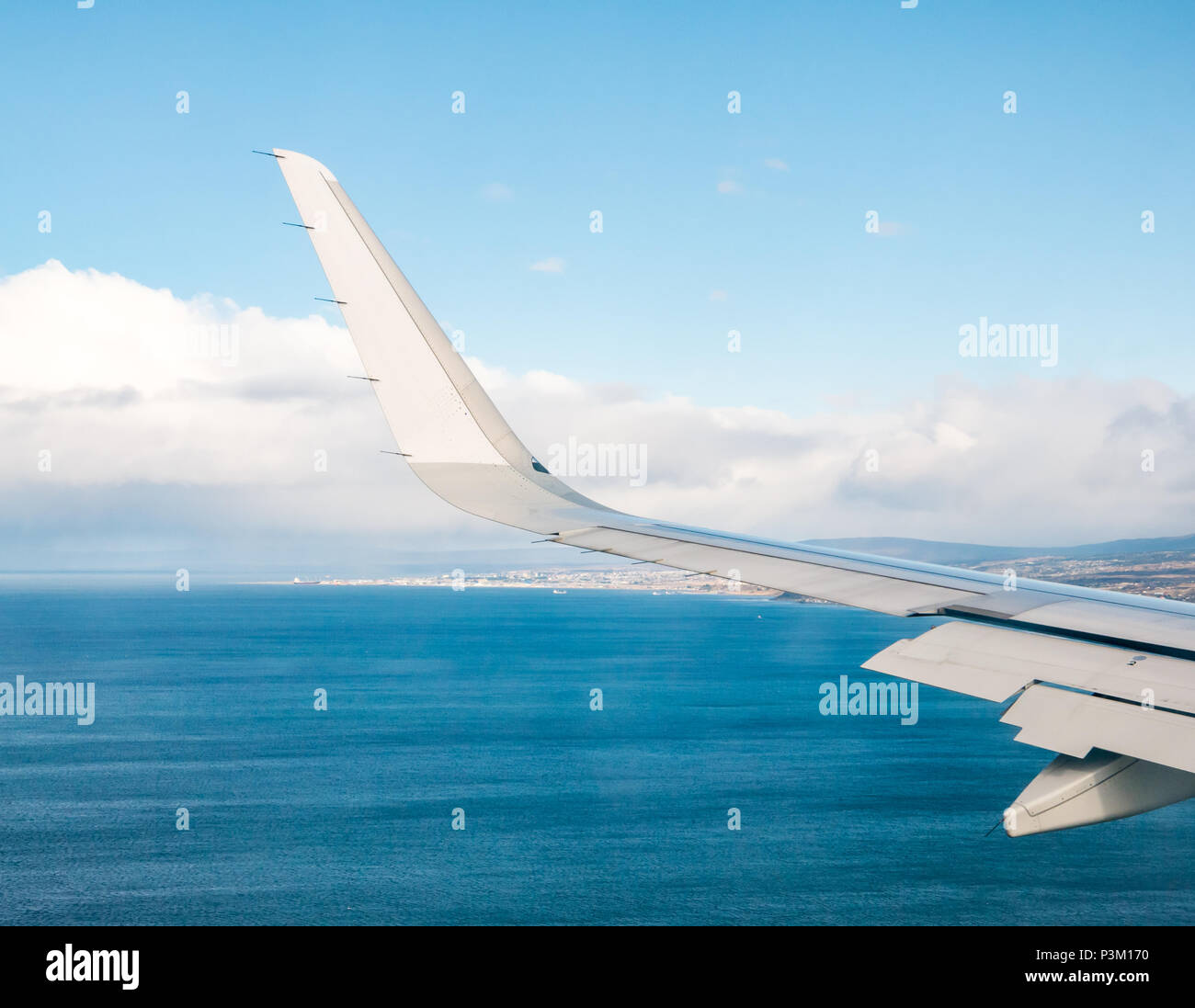 Wing of aeroplane over ocean hi-res stock photography and images - Alamy