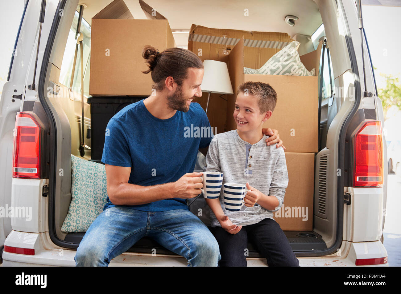 Back view of boy sitting on father hi-res stock photography and images ...