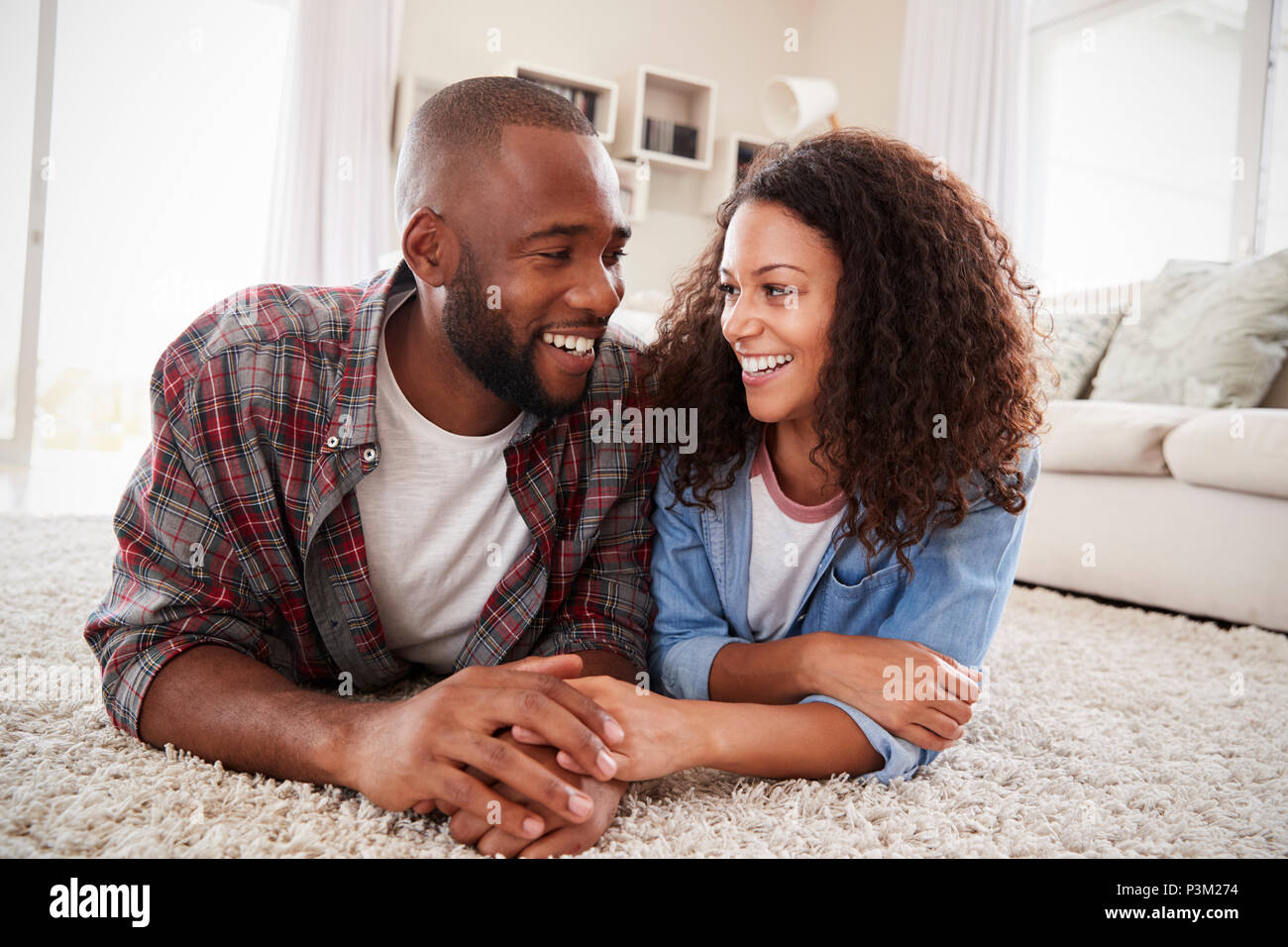Men lying on rug hi-res stock photography and images - Alamy