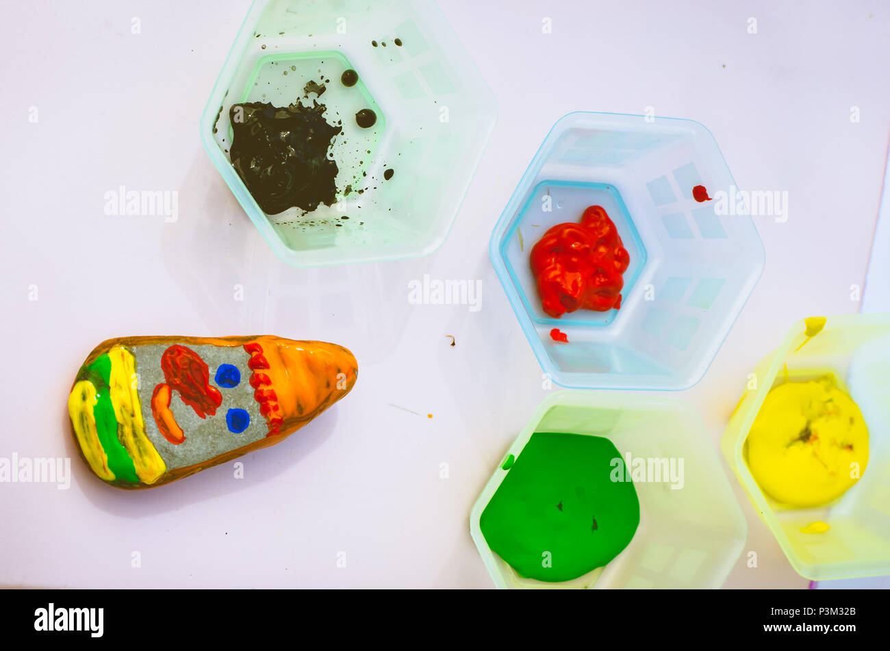 group of pebbles with bright paintings and colors Stock Photo - Alamy