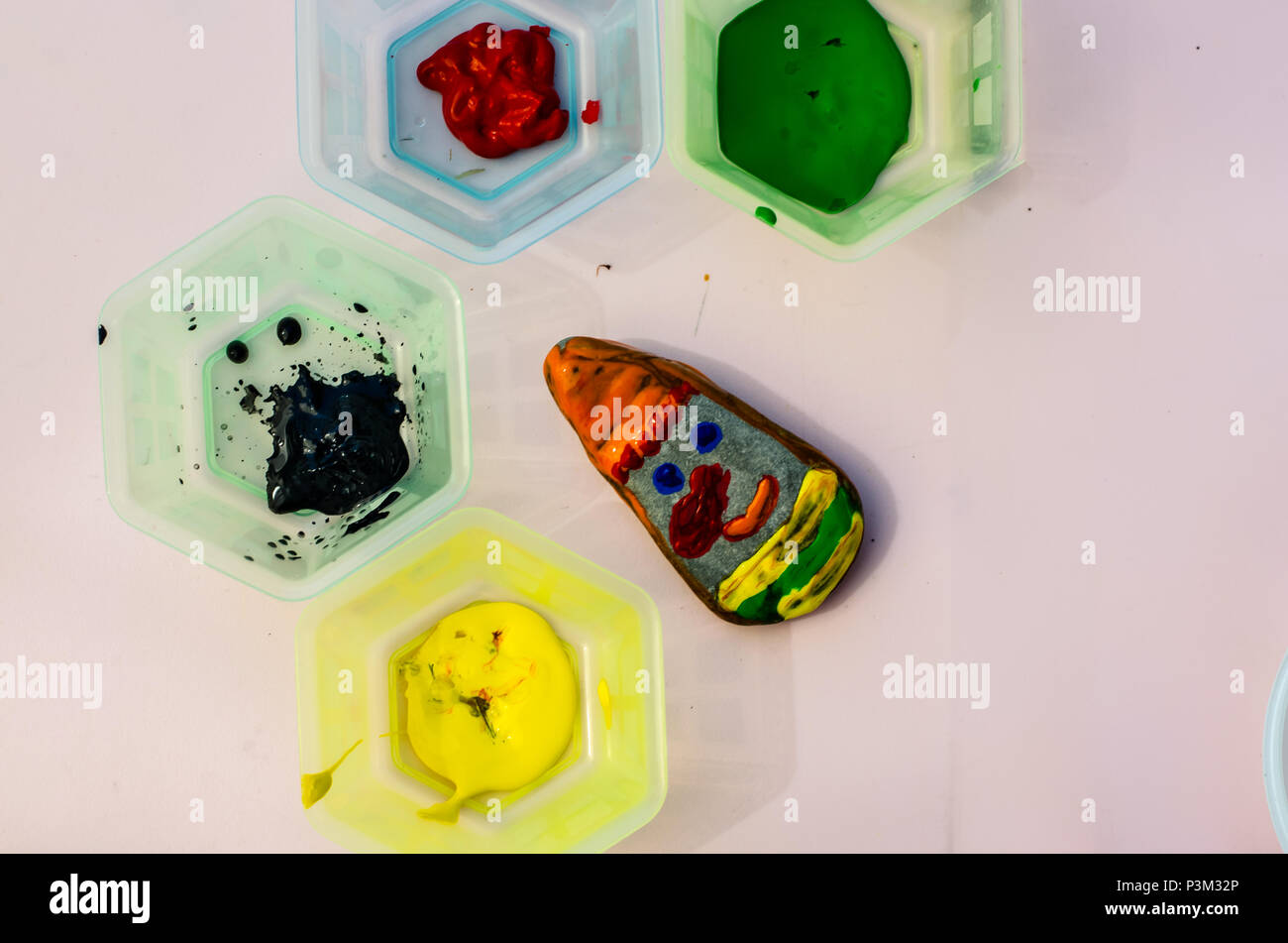 group of pebbles with bright paintings and colors Stock Photo - Alamy
