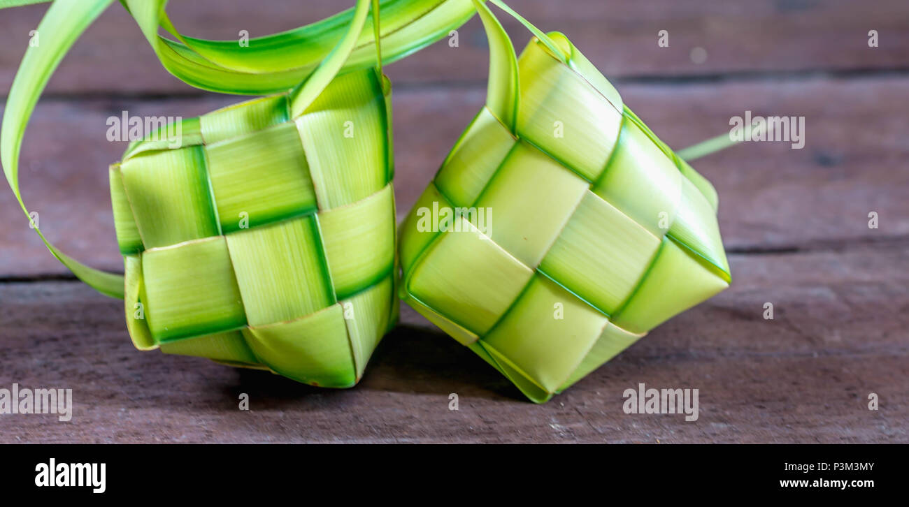 "Ketupat": steamed rice wrapped with woven young palm leaf. traditional ...