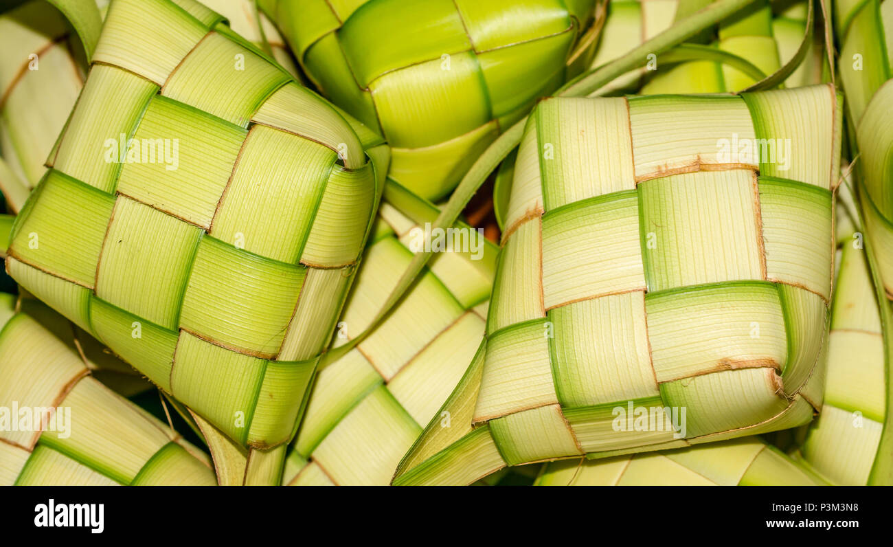 "Ketupat": steamed rice wrapped with woven young palm leaf. traditional ...