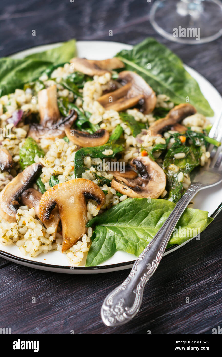 Plate with a Mushroom, Spinach Risotto Stock Photo - Alamy