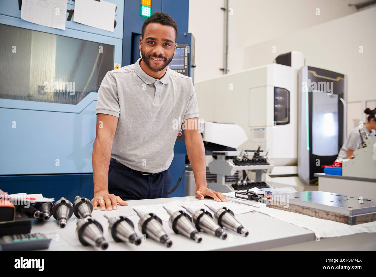 Portrait Of Male Engineer With CAD Drawings In Factory Stock Photo - Alamy
