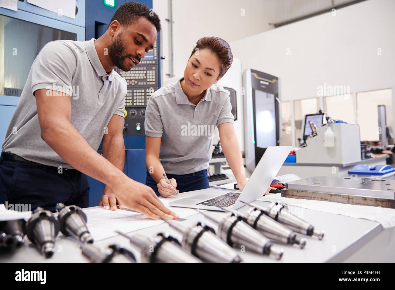 Two Engineers Using CAD Programming Software On Laptop Stock Photo - Alamy