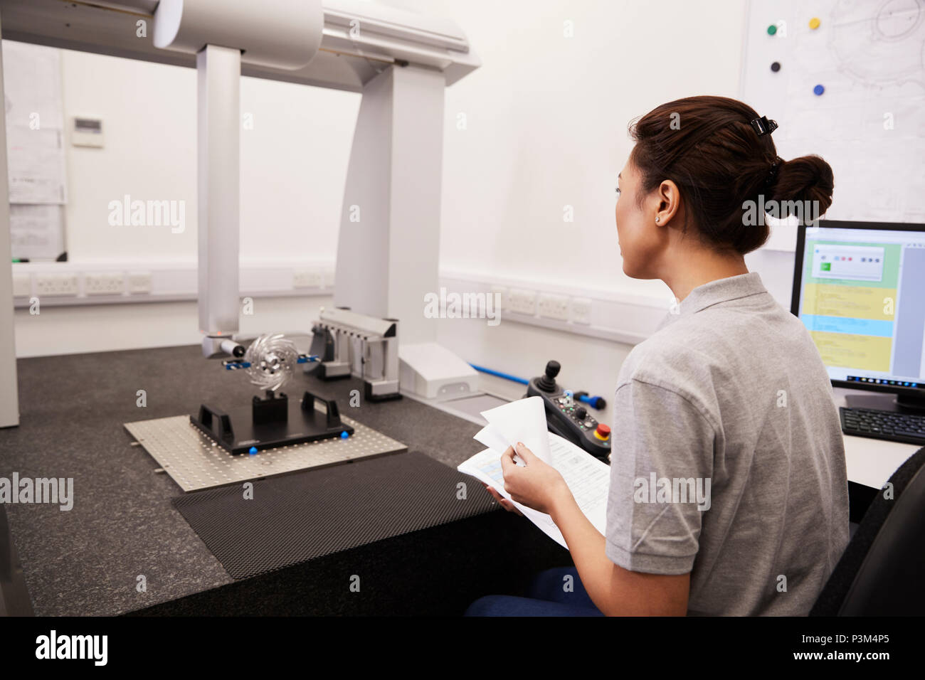 Asian female engineer measuring machine hi-res stock photography and ...