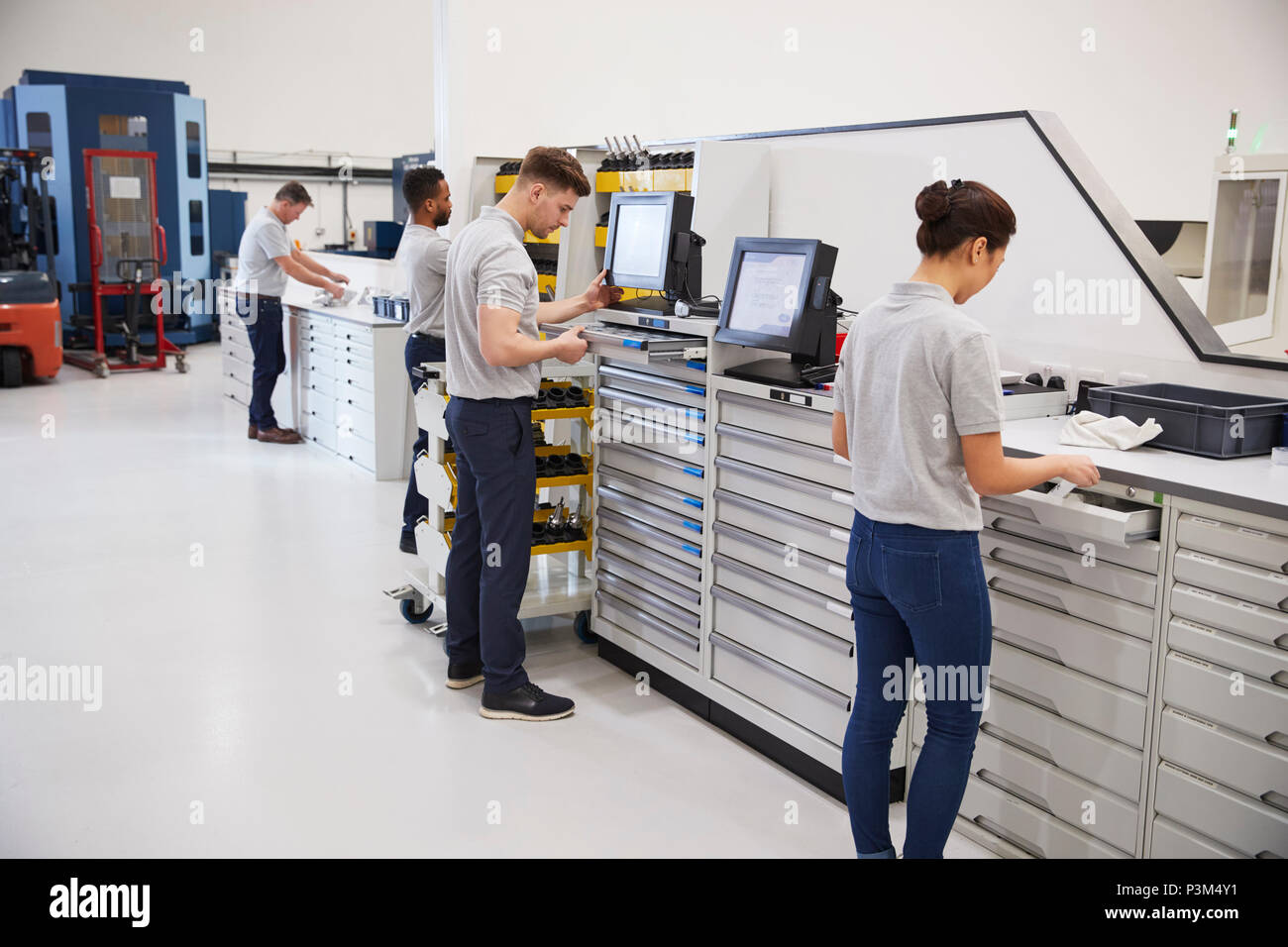 Engineers Selecting Tools For Use On Machinery In Factory Stock Photo ...