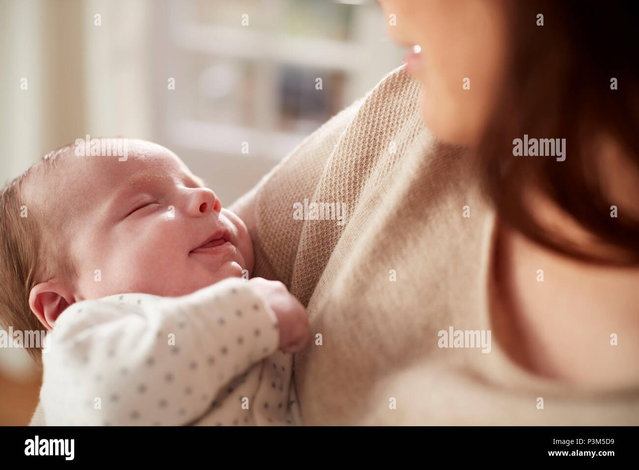 Happy baby being held hi-res stock photography and images - Alamy