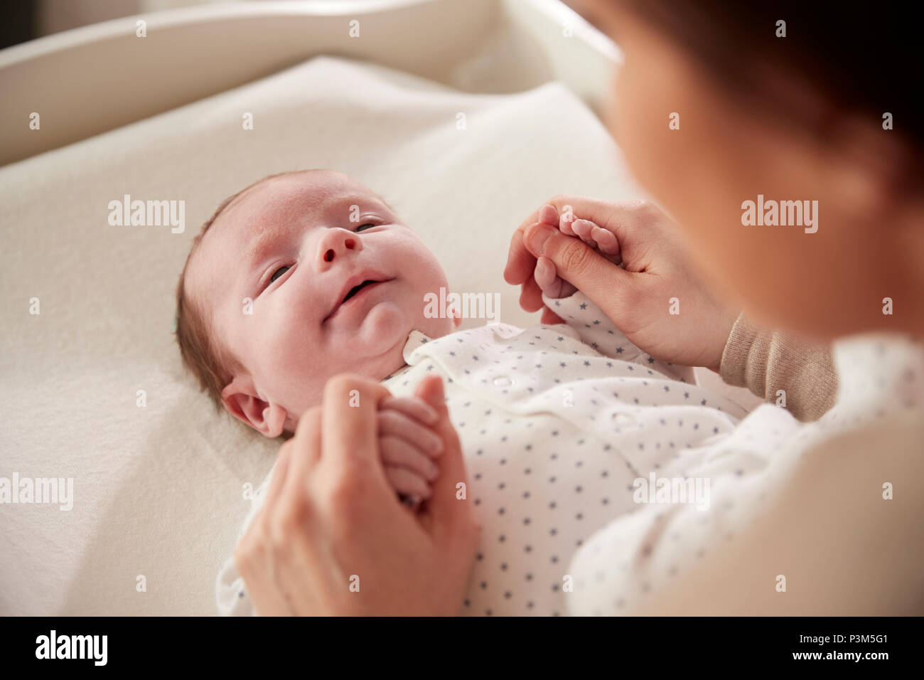 Mother baby on changing table hi-res stock photography and images - Alamy