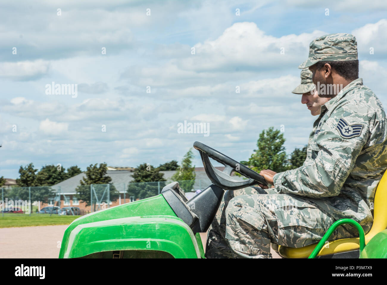 U.S. Air Force Staff Sgt. Trevor Brown (front), sports director with ...